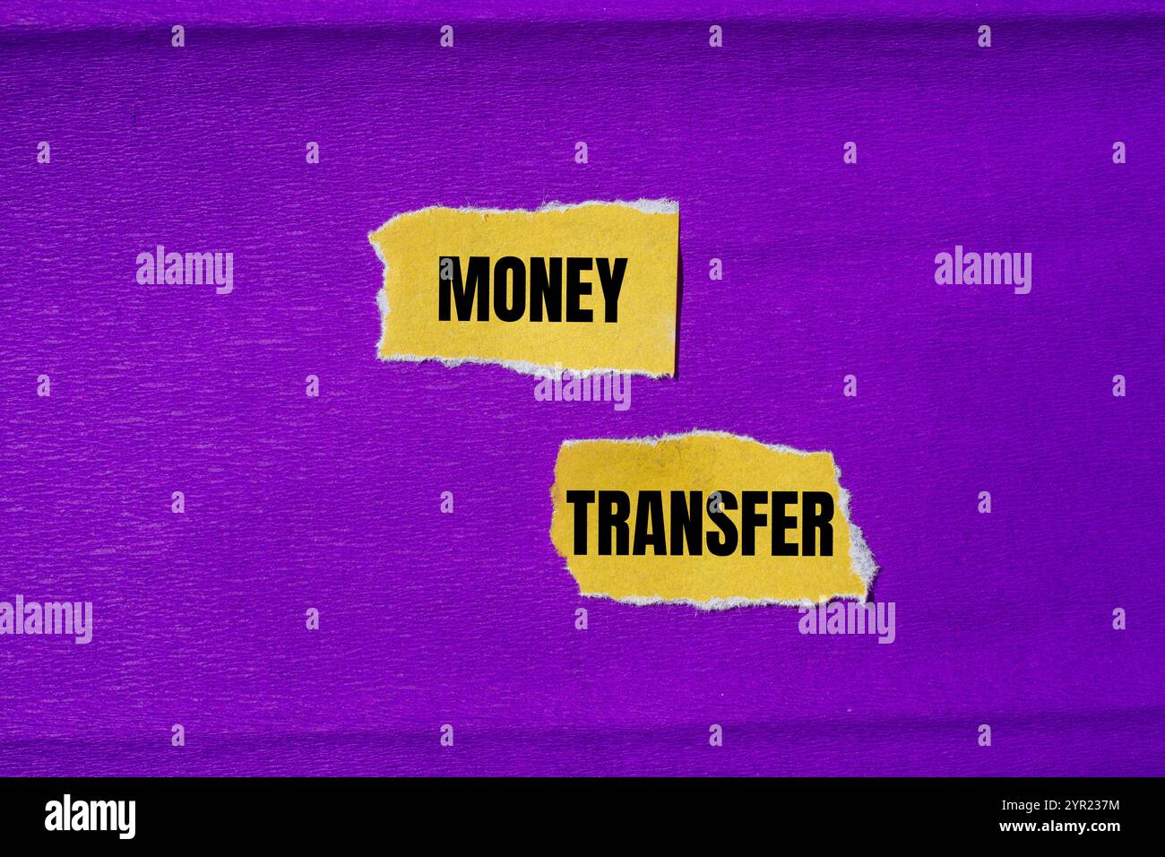 Money transfer message written on ripped torn yellow paper pieces with ...