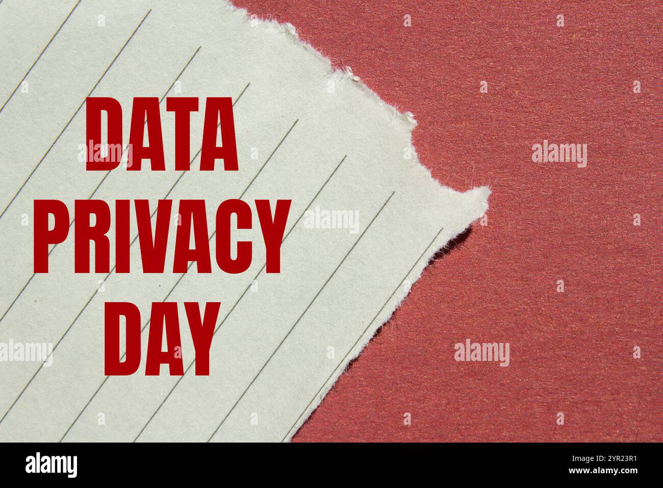 Data privacy day message written on ripped torn lined paper with red ...
