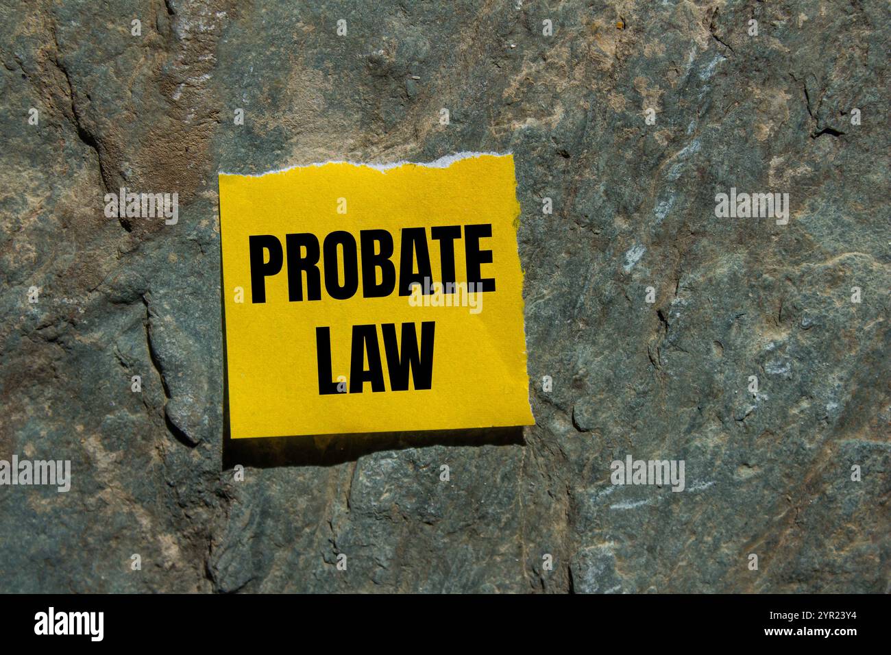 Probate law message written on ripped torn yellow paper piece with ...