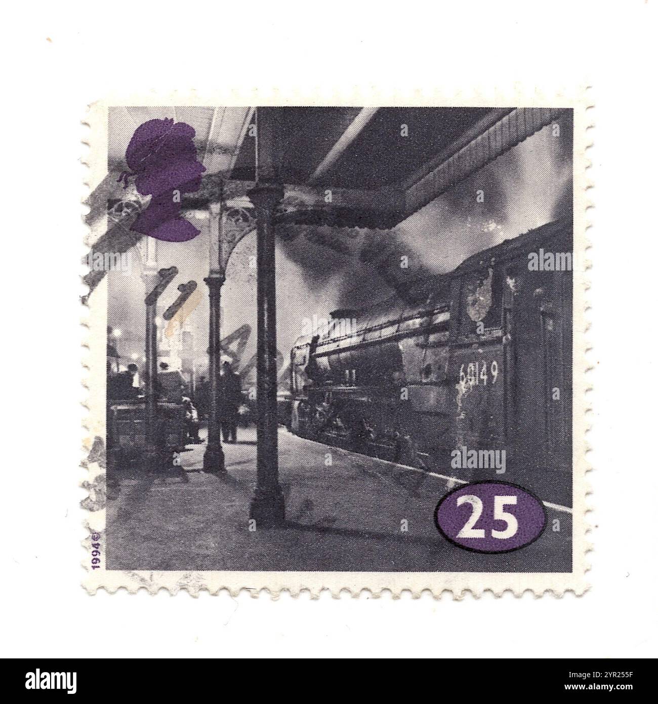 A vintage postage stamp from Great Britain featuring a steam train in a ...