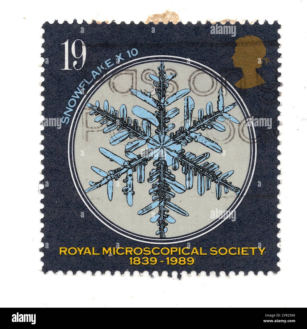 A vintage postage stamp from Great Britain featuring the Royal ...