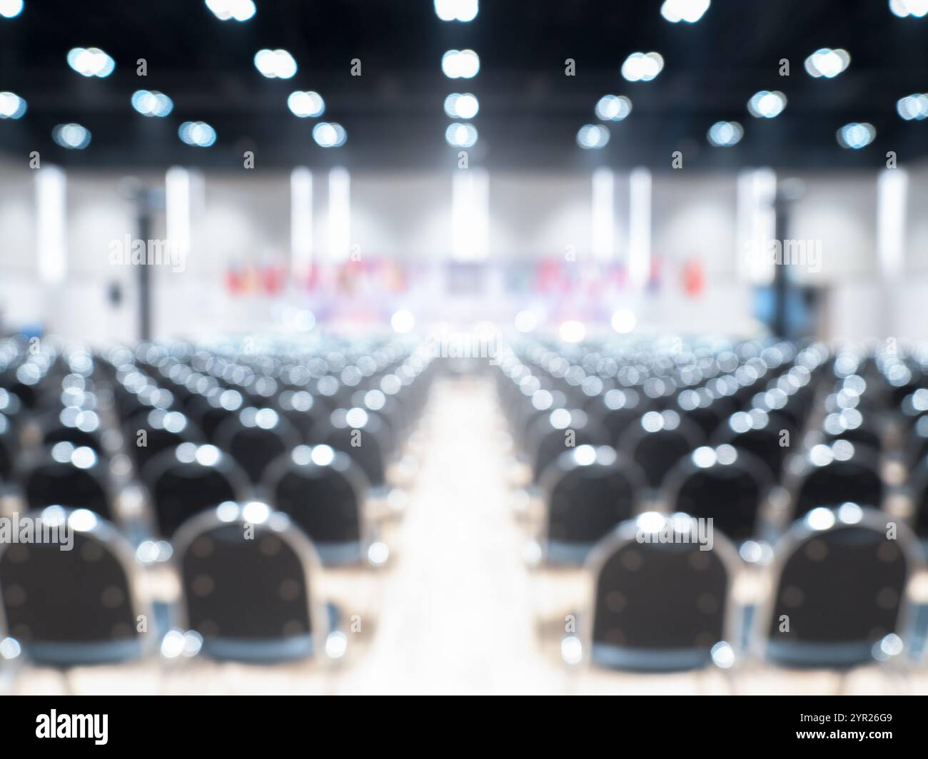Abstract blurred international seminar conference with empty chairs ...