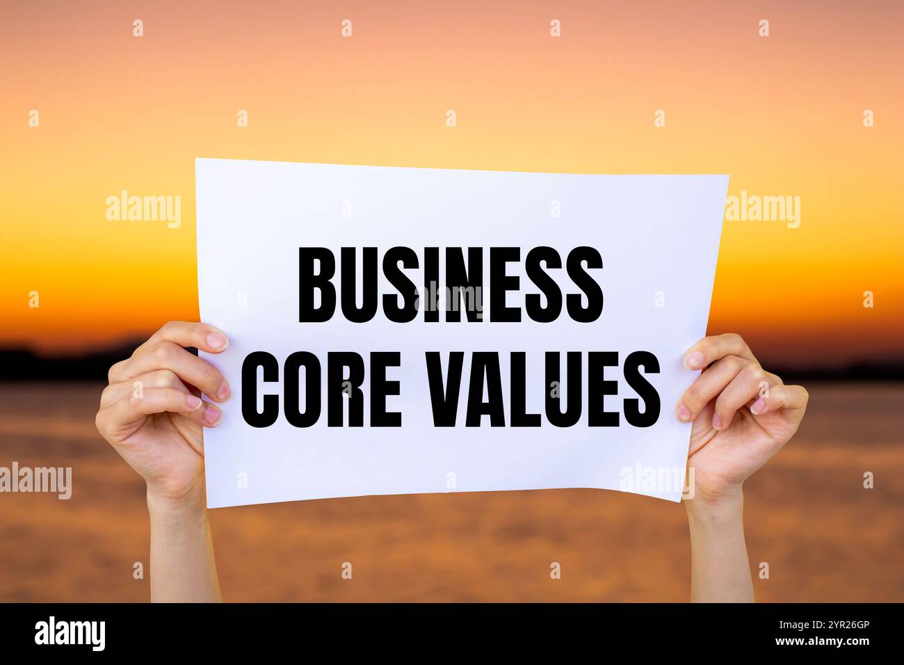 Business core values message written on white paper with blurry lake ...