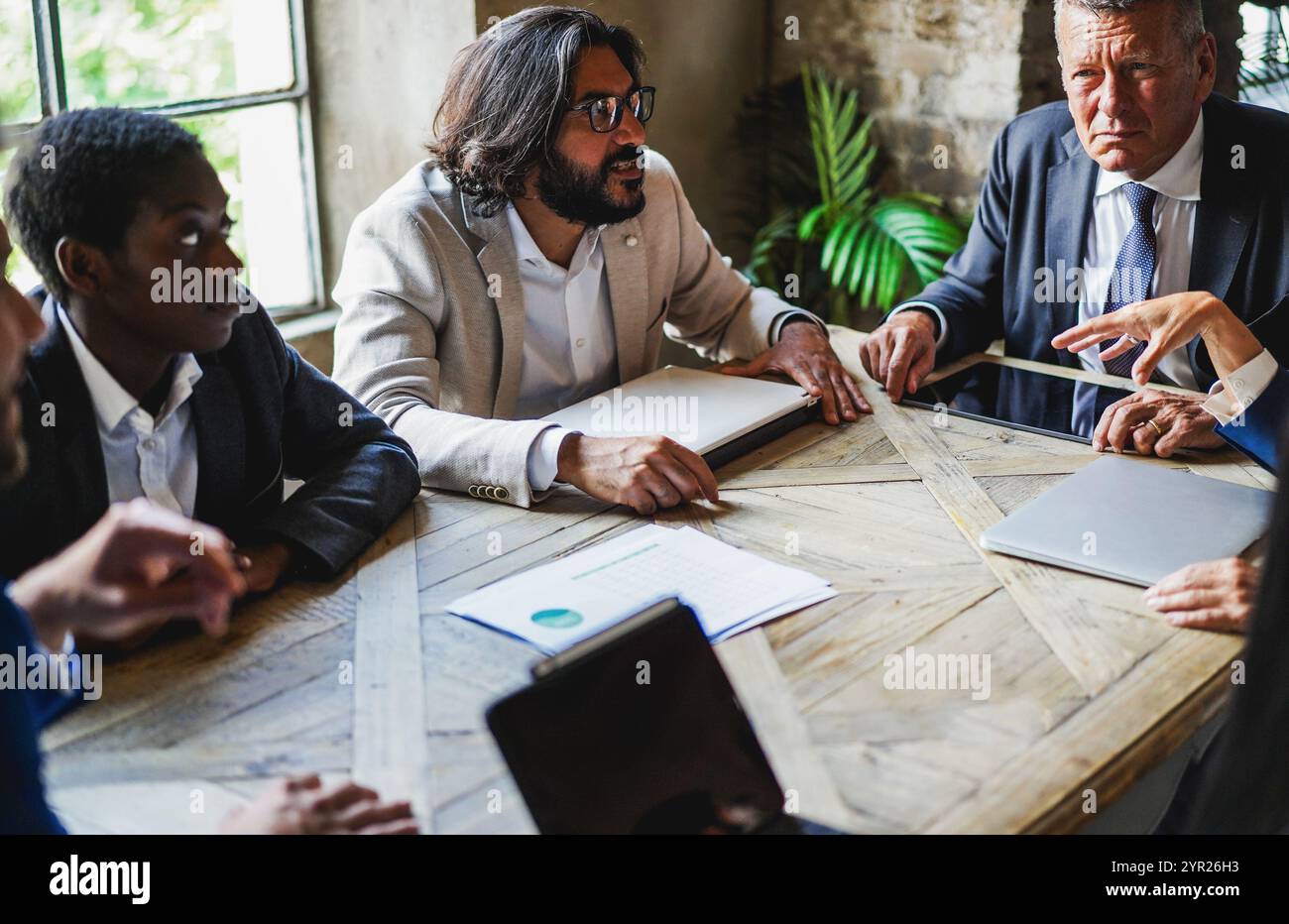 Business people sharing ideas at teamwork meeting - Multiracial ...