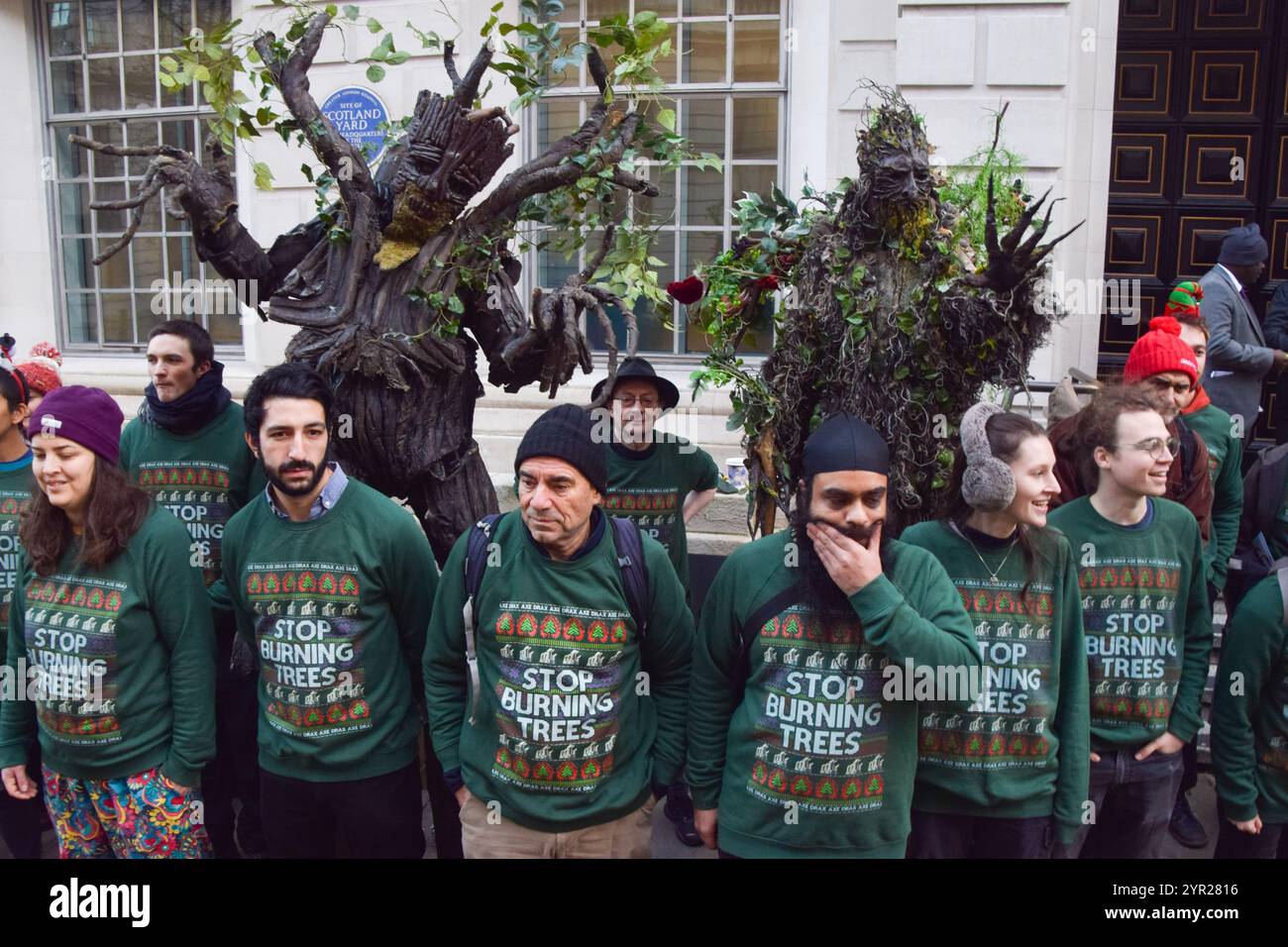 London, UK. 2nd December 2024. Protesters dressed as humanoid trees ...