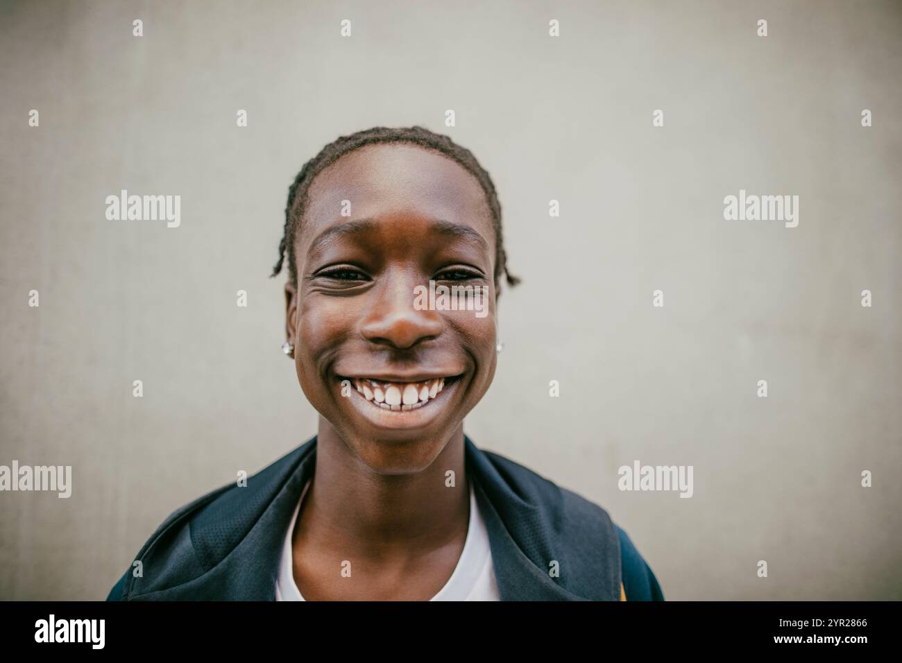 Portrait of teenage boy with toothy smile Stock Photo - Alamy