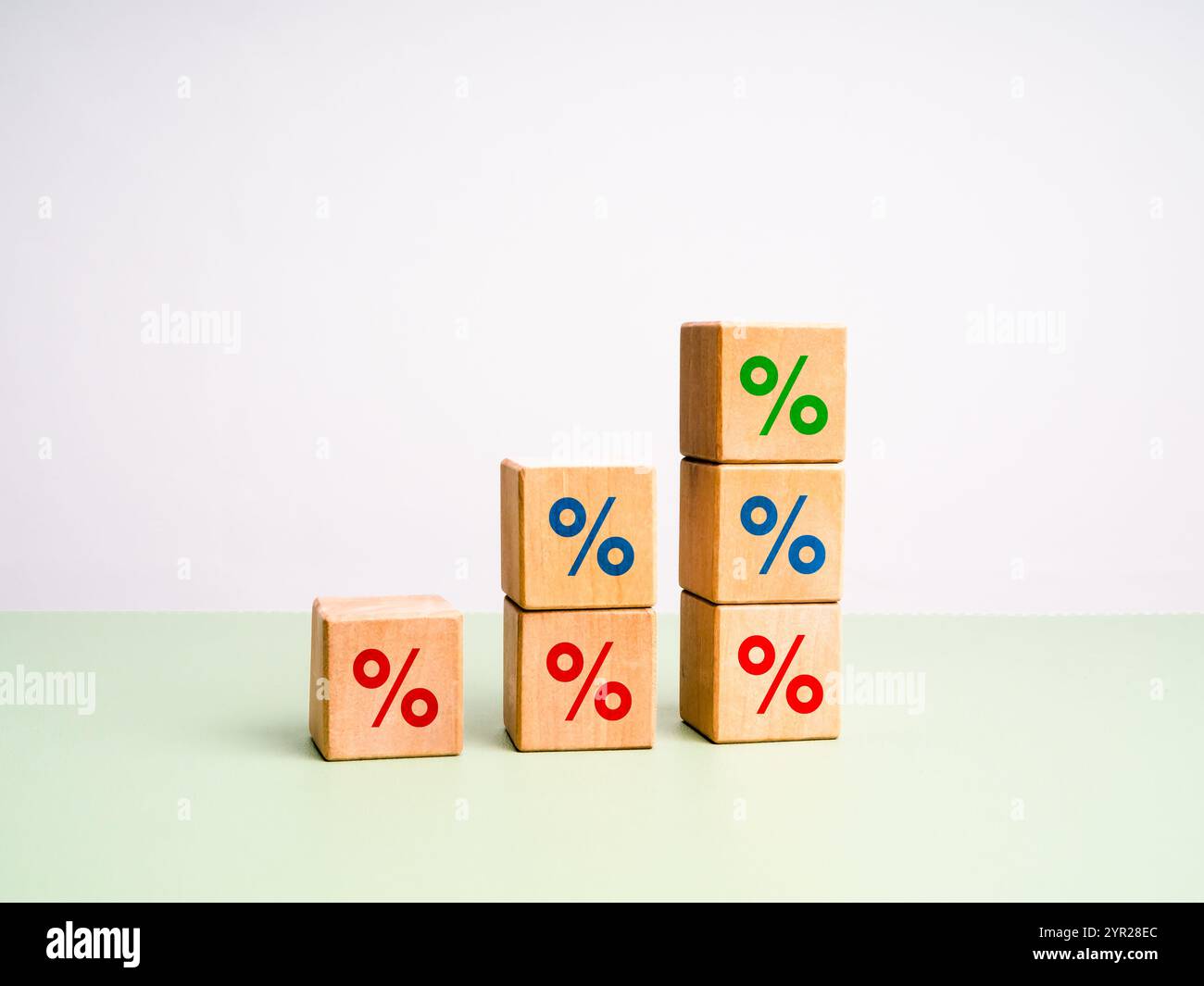 Green, blue and red colors of percentage icons on wooden cube blocks ...