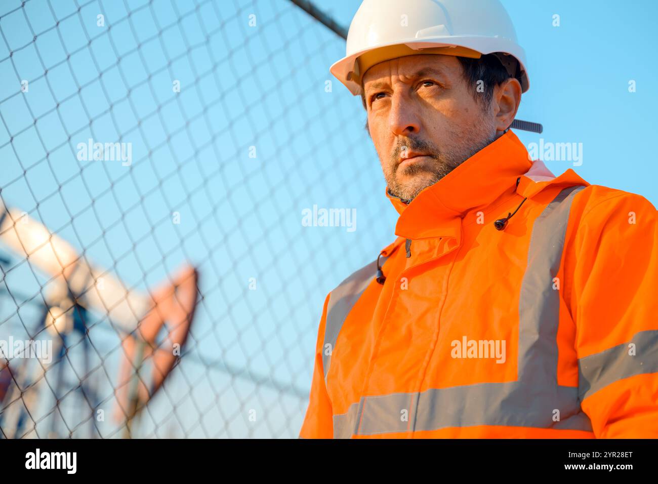 Drilling rig engineer supervising the process of oil and gas extraction ...