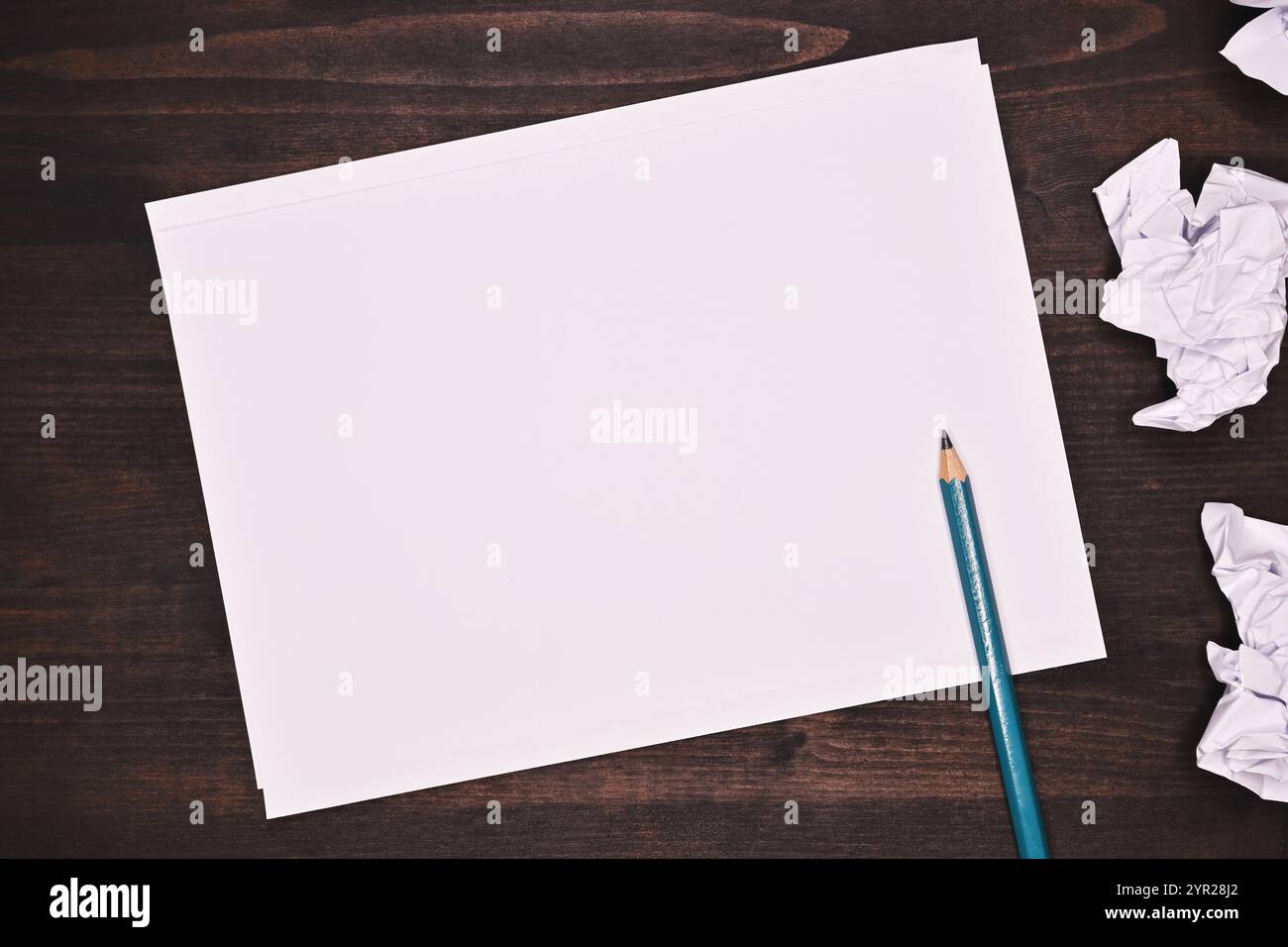 Blank white paper with crumpled balled up paper on office desk, mockup ...