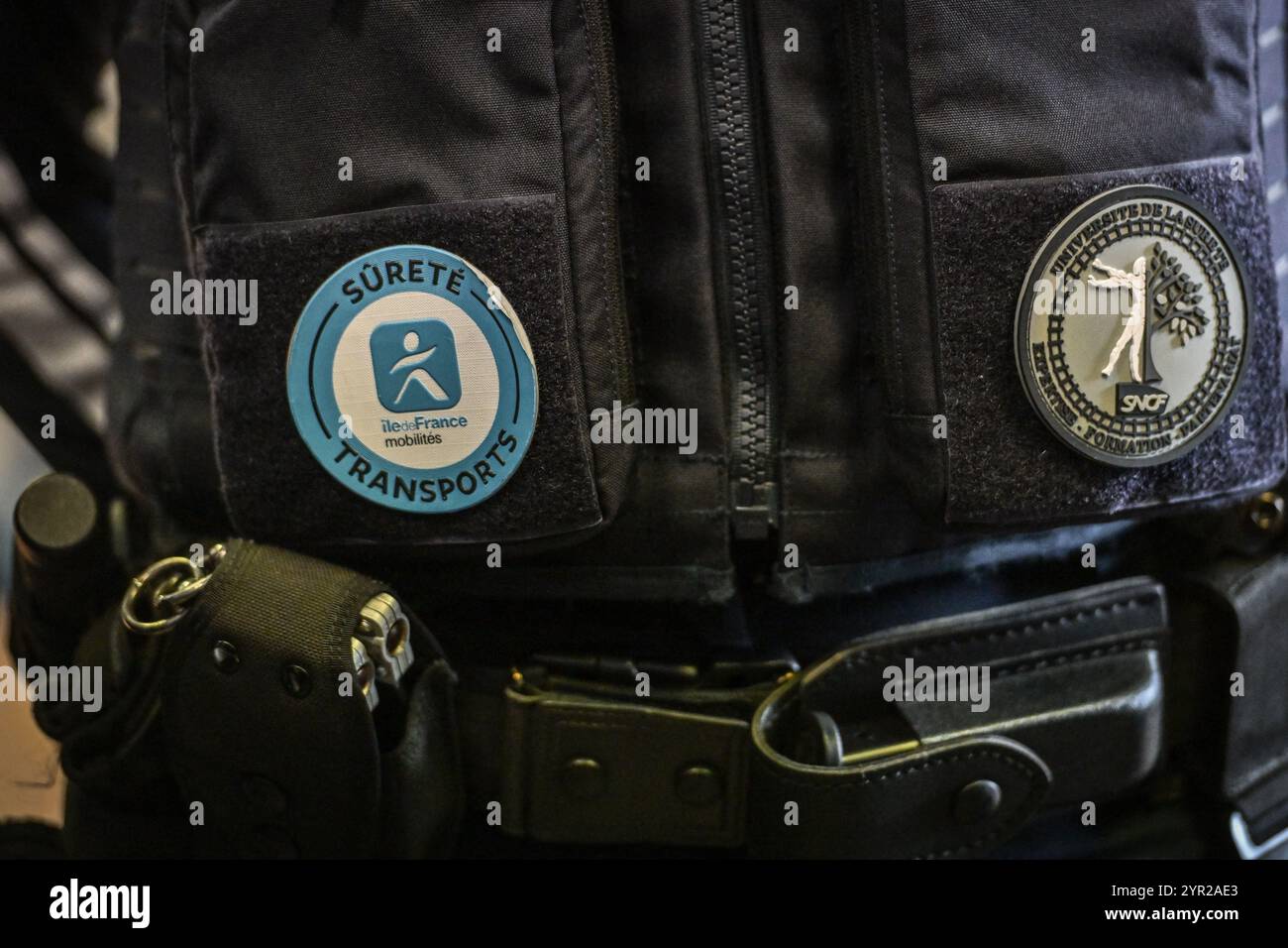 Paris, France. 02nd Dec, 2024. This photograph shows security badges ...
