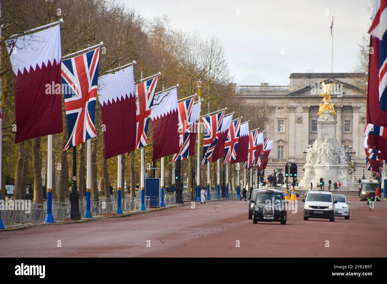 London, UK. 2nd December 2024. Flags of Qatar and Union Jacks line The ...