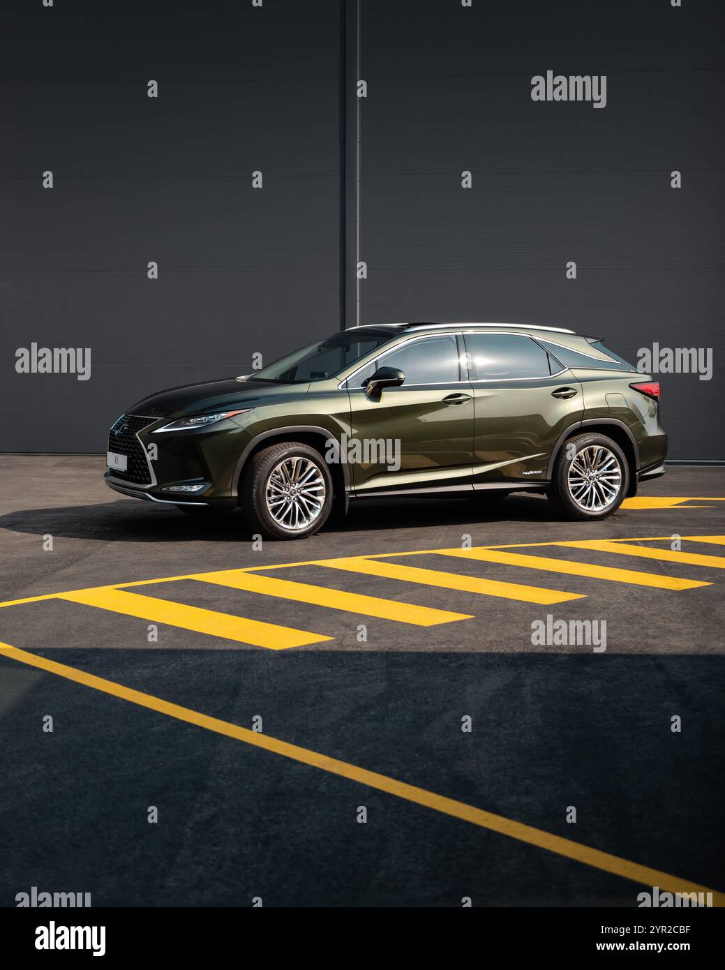 Green Lexus RX in urban setting. Front three quarter view of japanese ...