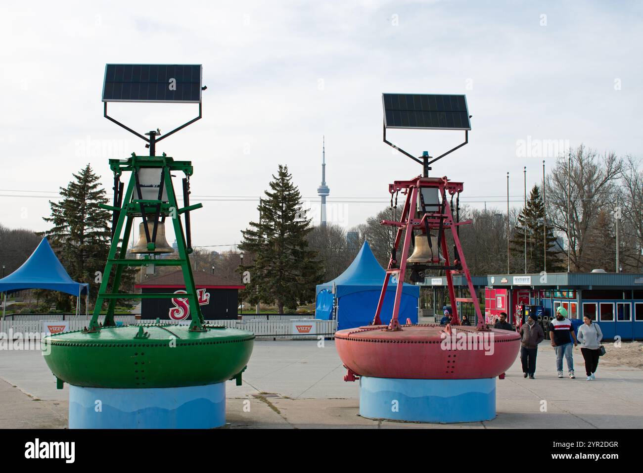 Red and green buoys stand at the entrance to Centre Island Pier. A ...