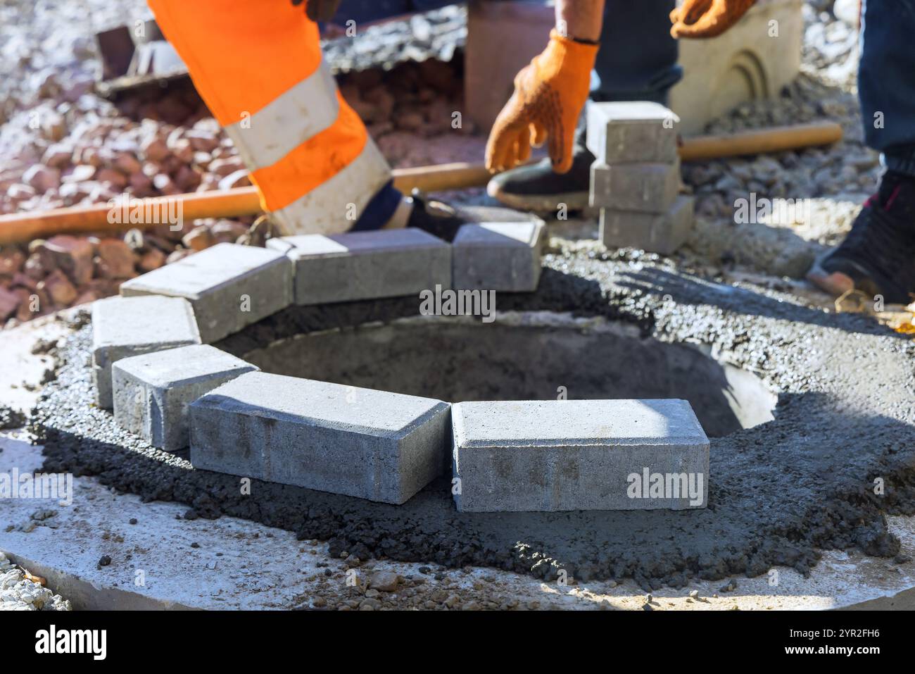 In fresh concrete is securing blocks making up uppermost edge of ...
