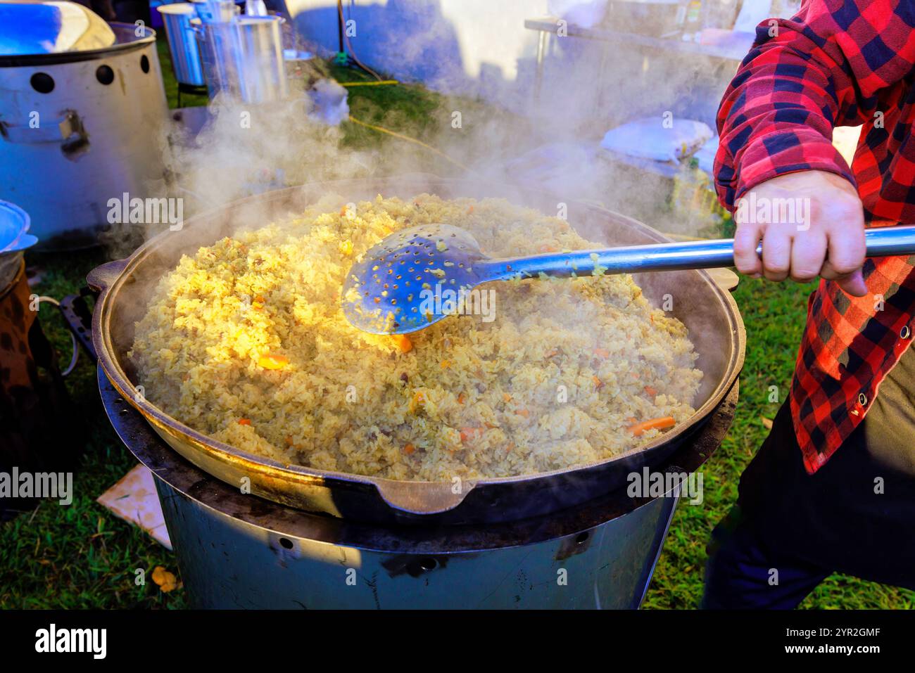 Turkish pilaf is traditionally cooked in large cast iron cauldron Stock ...