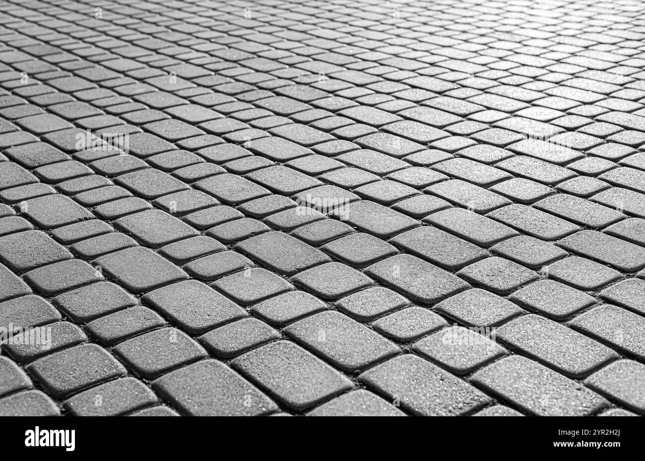 Concrete road paving stones background Stock Photo - Alamy