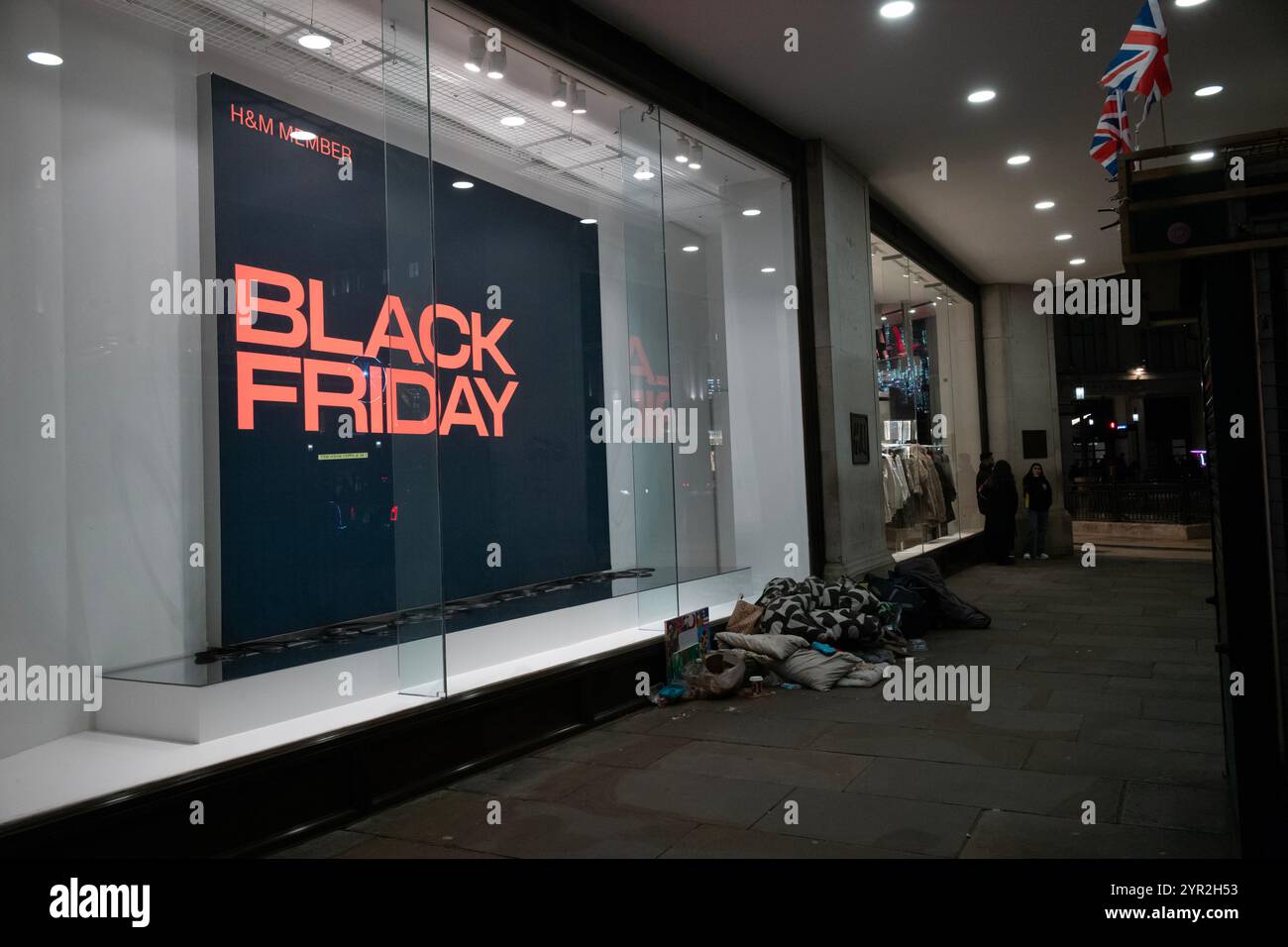 Homeless rough sleeper settles for the night under a Black Friday ...