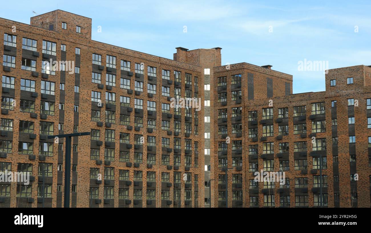 large multi-storey residential complex made of brown brick, view from ...