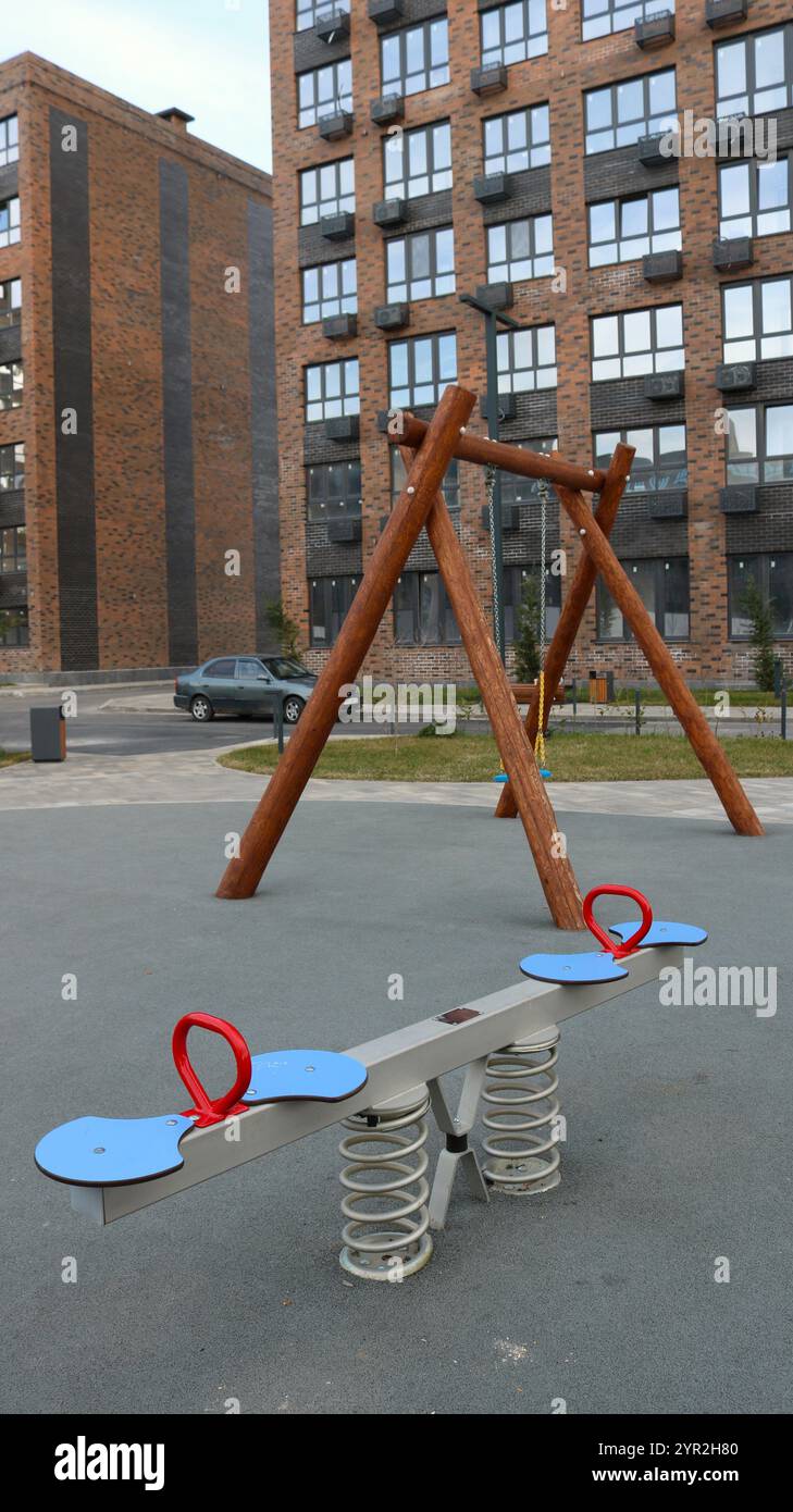 children's playground in the courtyard of a residential complex made of ...