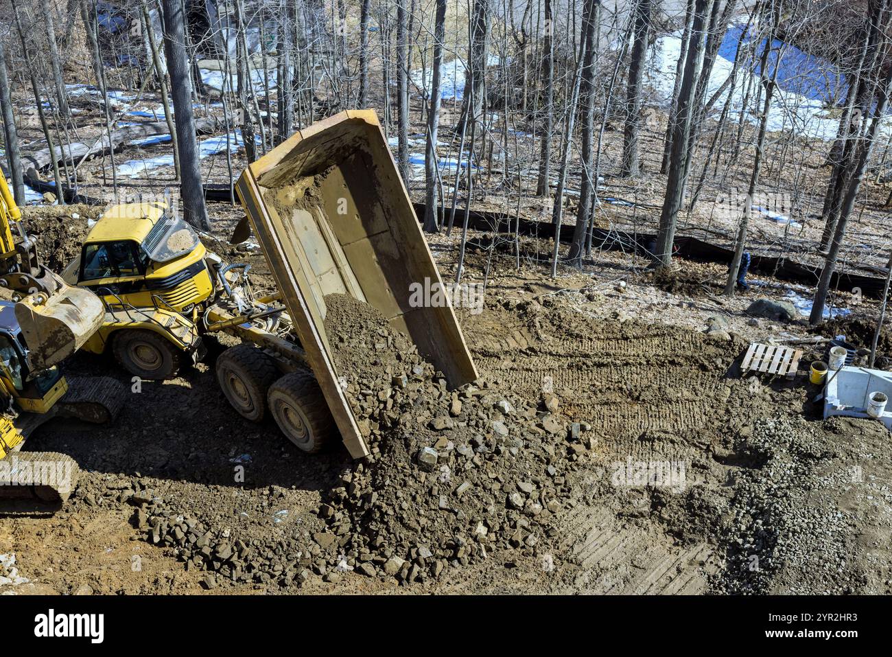 Truck vehicle is unloading large amount of construction dirt at ...
