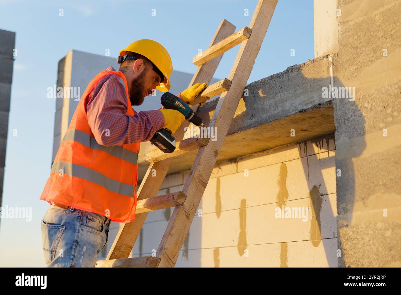 Construction worker using blue hi-res stock photography and images - Alamy