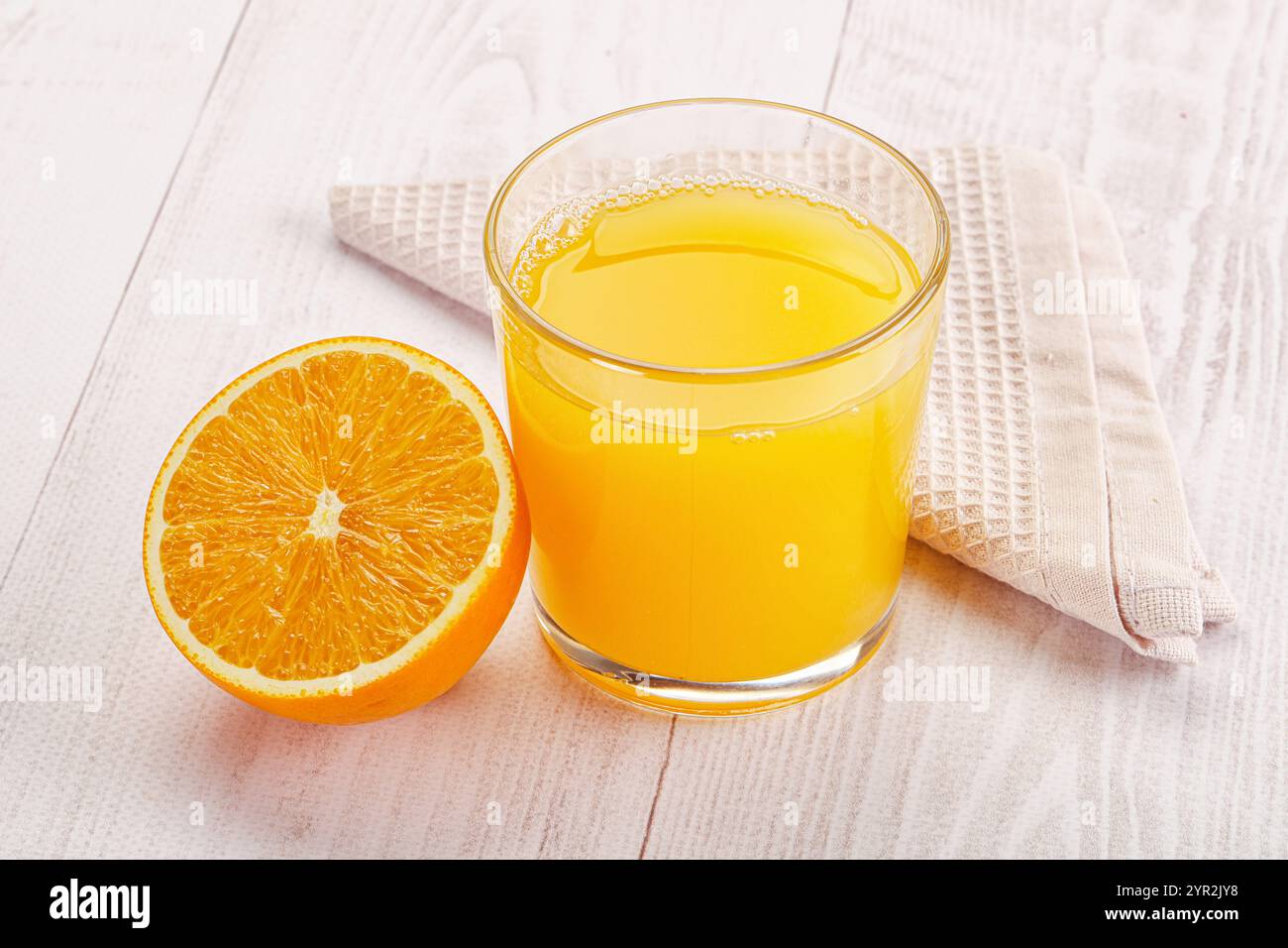 Sweet fresh orange juice in the glass with half fruit Stock Photo - Alamy
