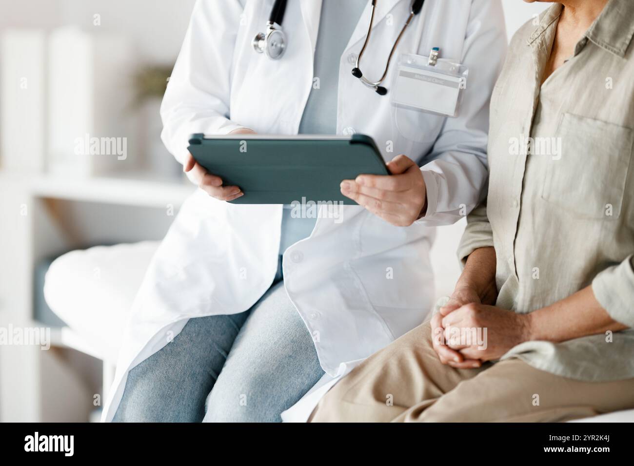 Female patient listening to a doctor in hospital Stock Photo - Alamy