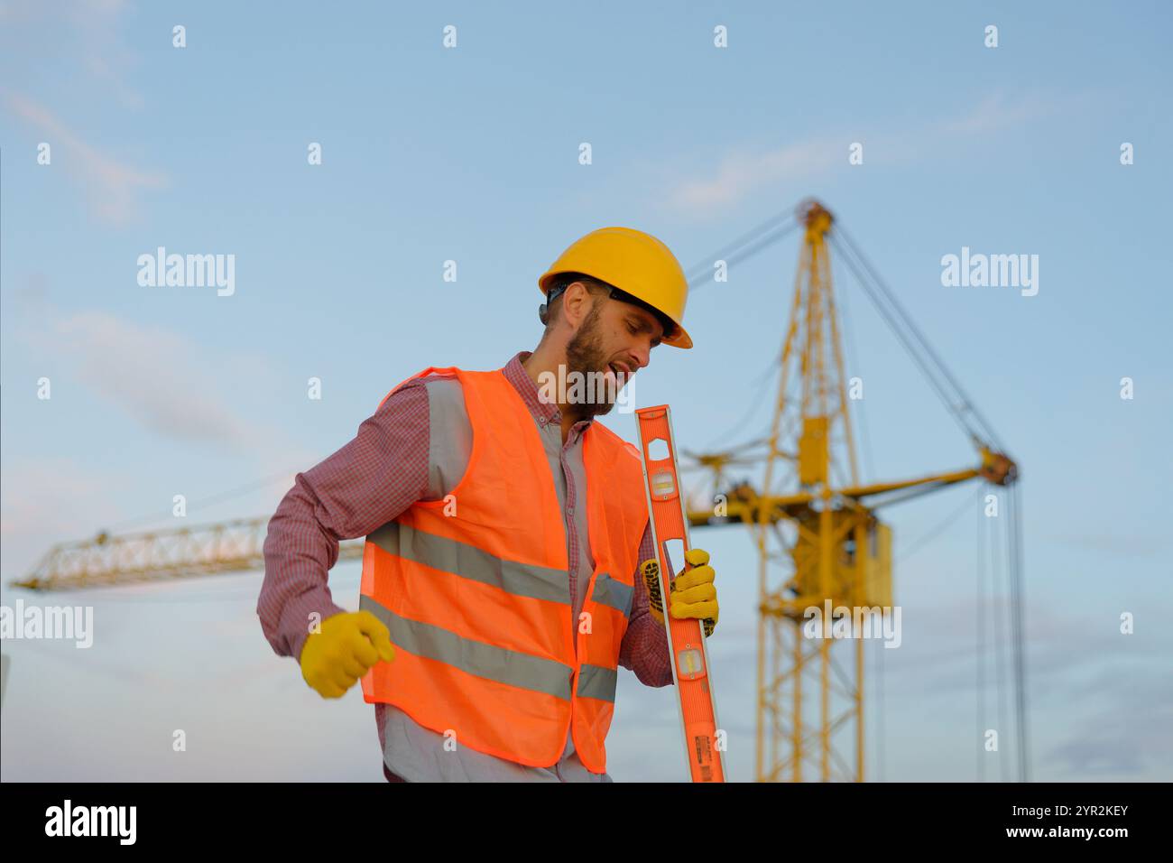 Construction putting on helmet hi-res stock photography and images - Alamy