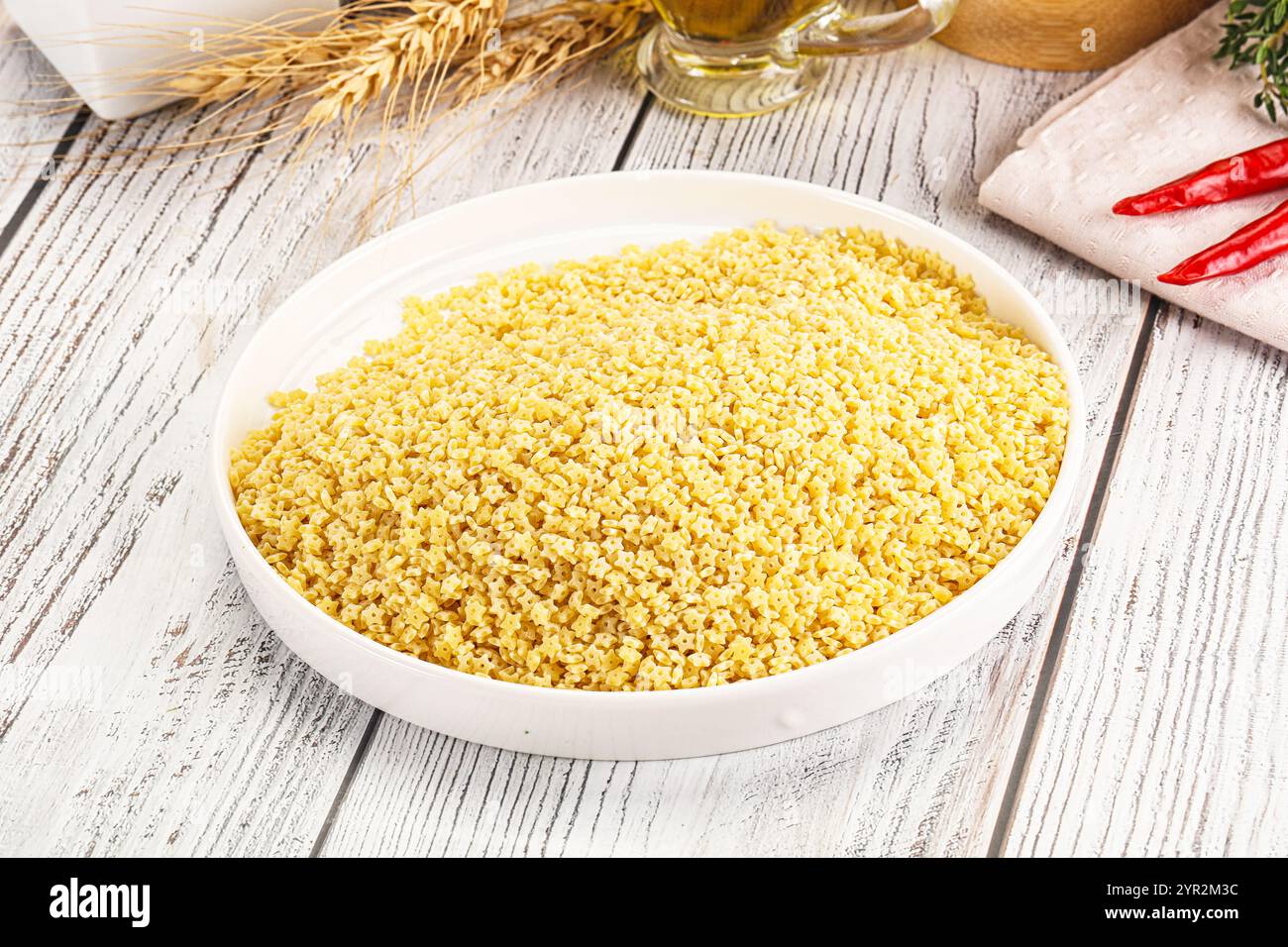 Italian cuisine - dry stelline pasta for bowl Stock Photo - Alamy