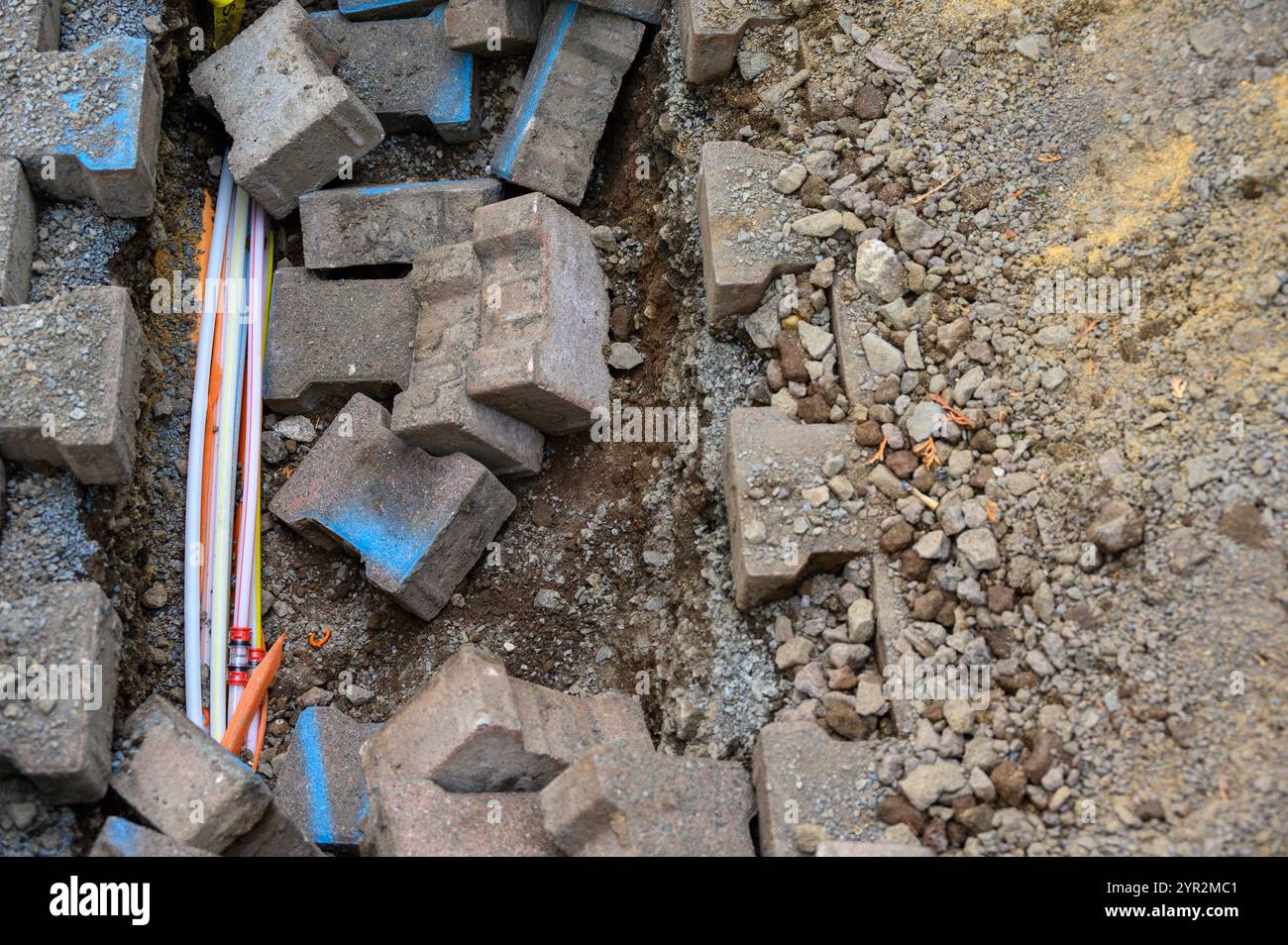 Construction site showing a trench filled with gravel and concrete ...