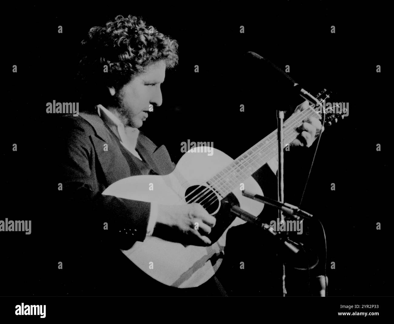 Bob Dylan performs live on stage with The Band as part of his 1974 Tour ...