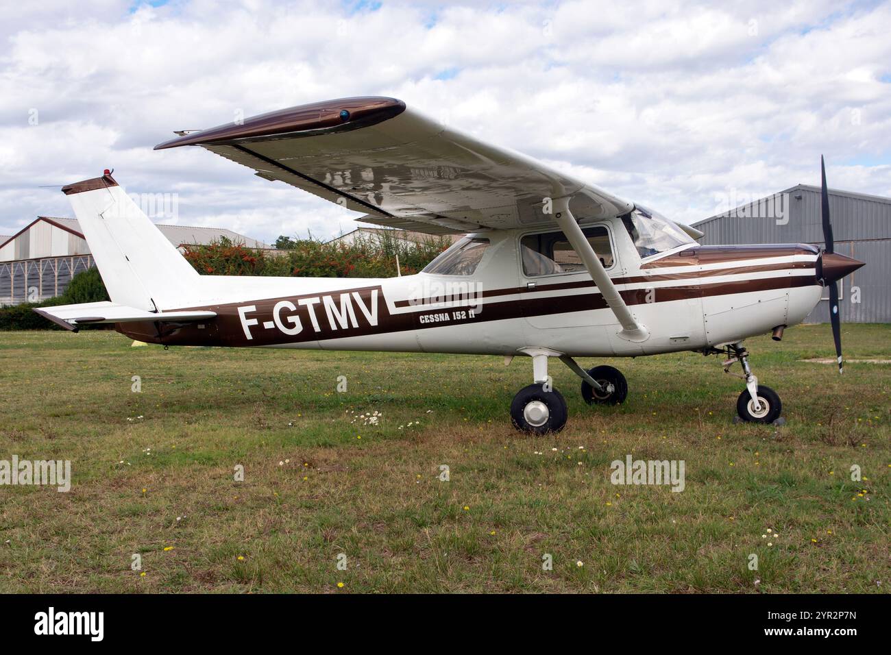 Cessna 152 light aircraft on the ground at a grass airfield in Nîmes in ...