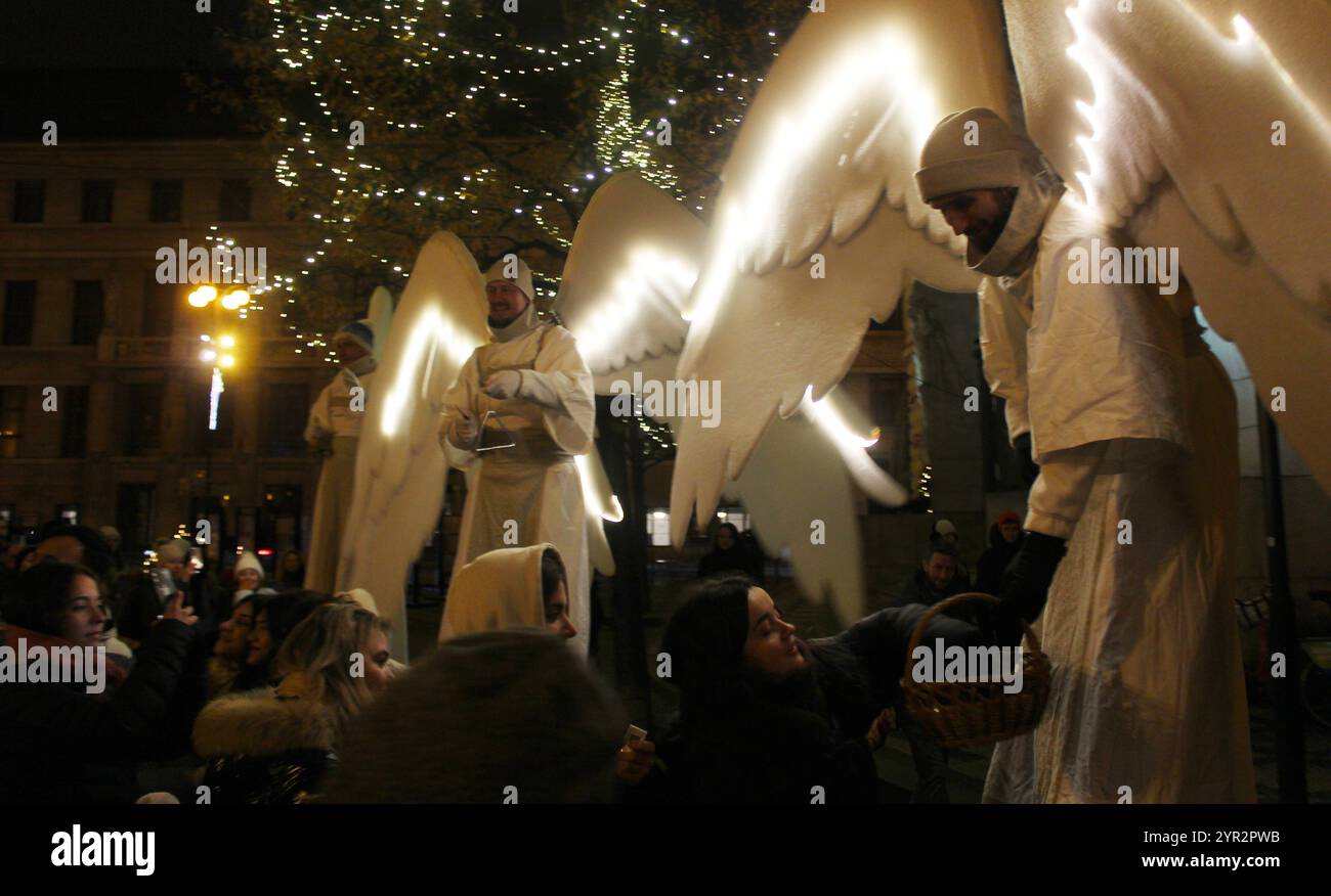 Giant angels on stilts walking in city center of Prague, Czech Republic ...