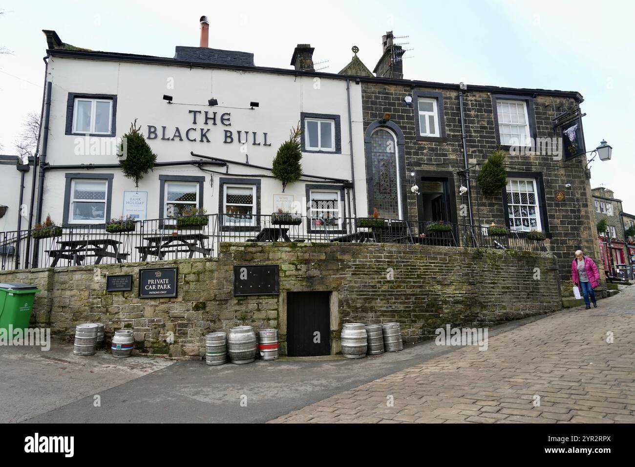 The 16th century Black Bull pub on Main St, built of Millstone Grit ...