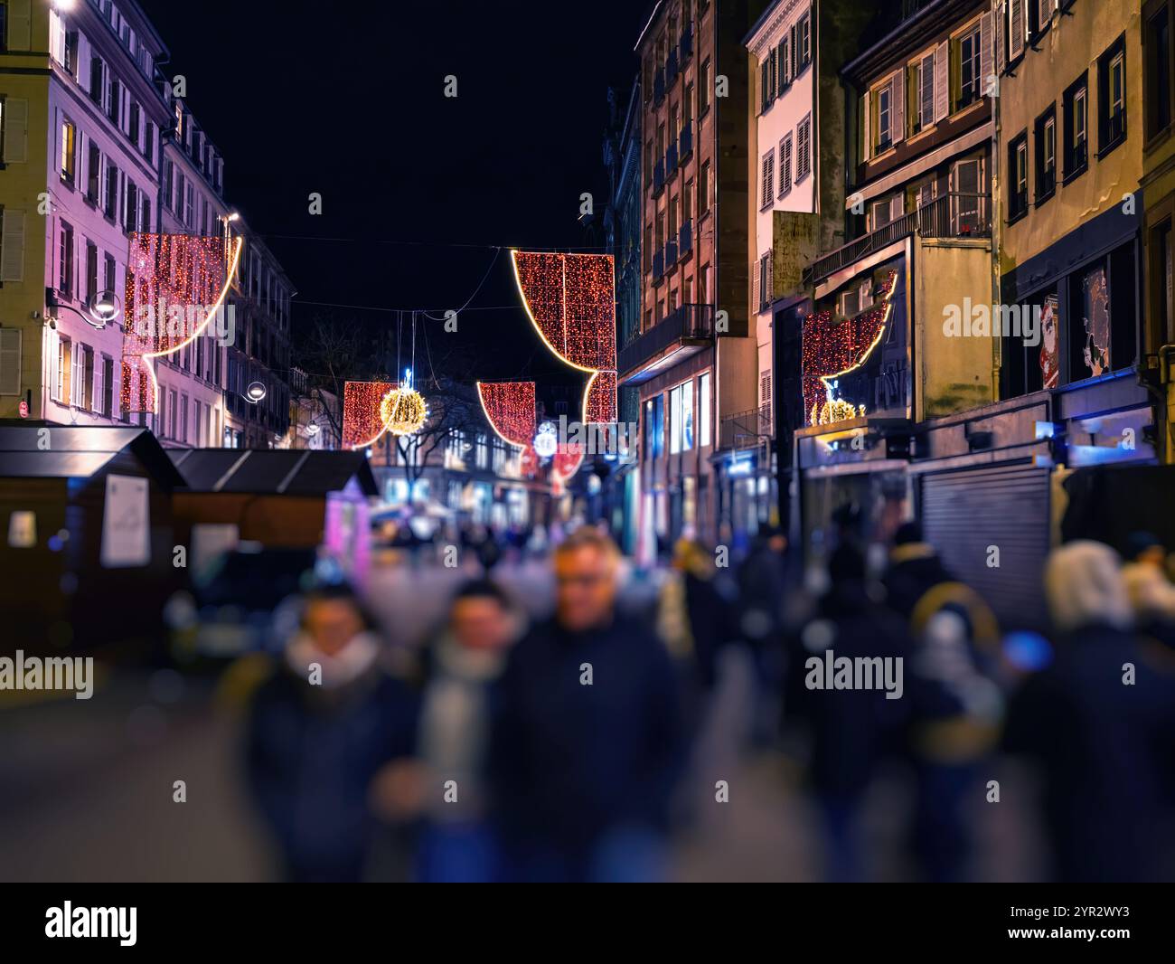 Vibrant night scene at Strasbourg Christmas Market with glowing red and ...