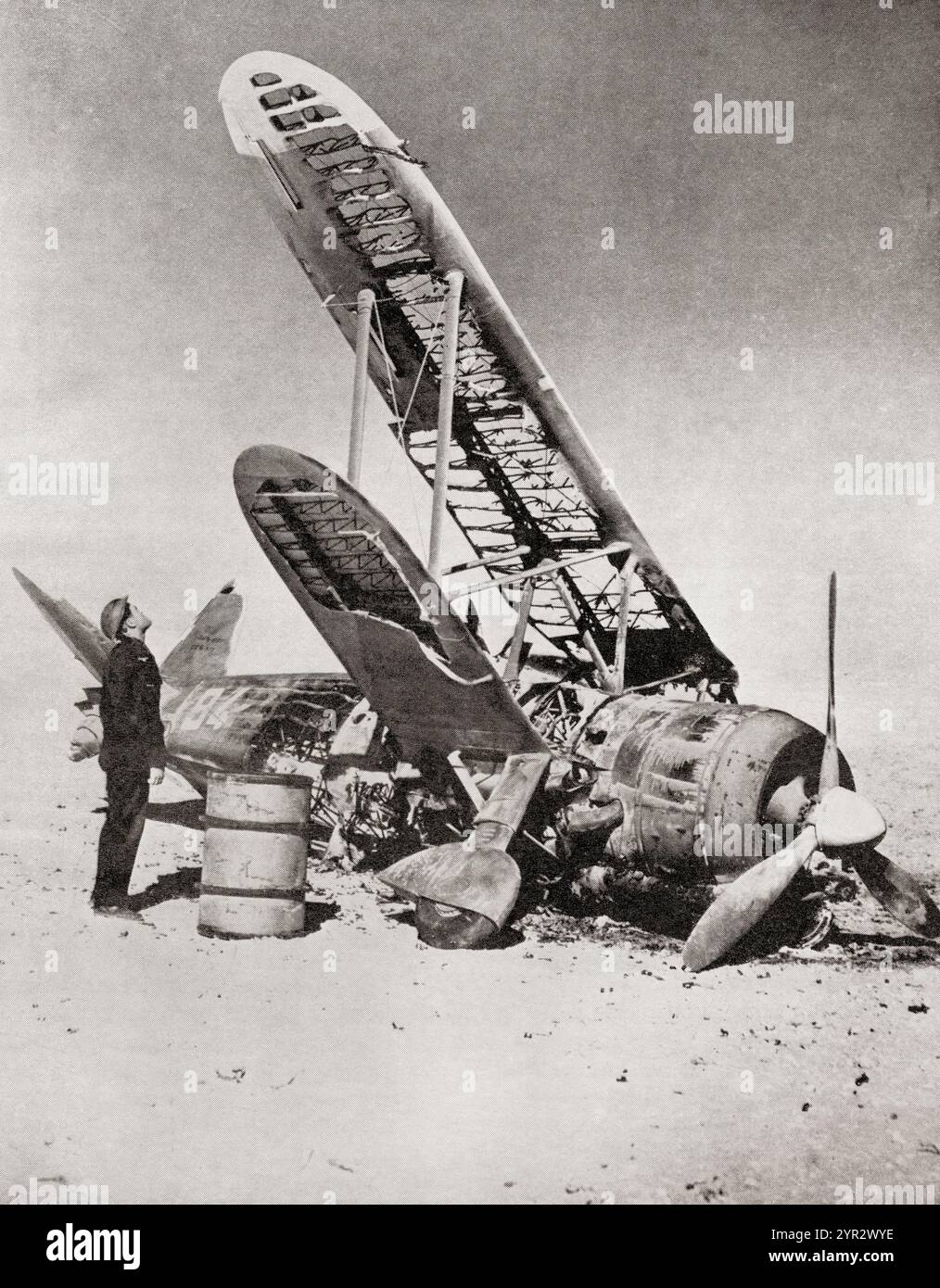 EDITORIAL A crashed Italian C.R.42 in the Lybian desert, WWII. From ...