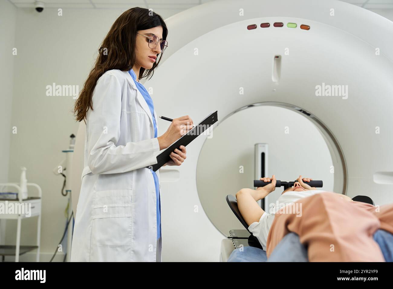 Doctor technician monitors mri scan hi-res stock photography and images ...