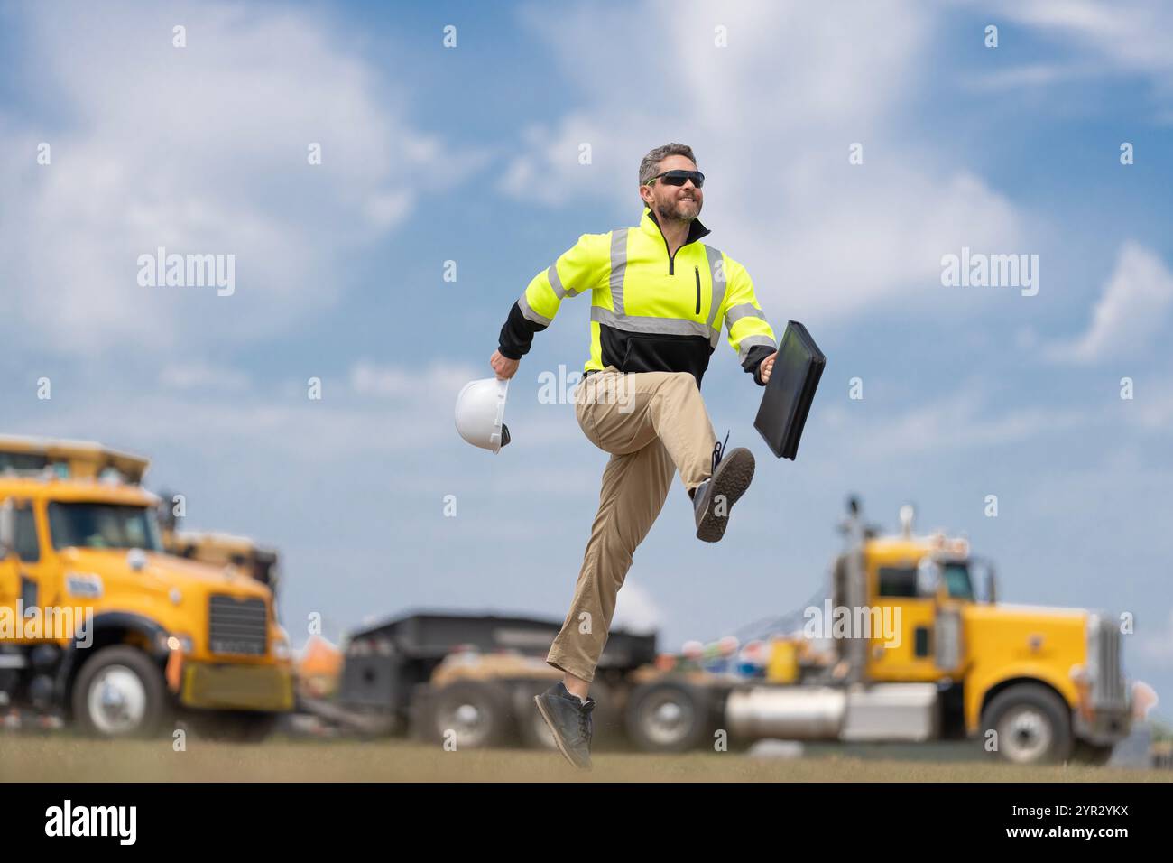 Builder man run fast to work. Engineer supervisor running outdoor ...