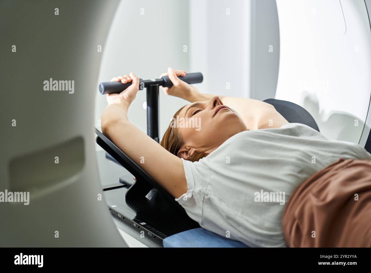 A patient undergoing an MRI scan in a hospital environment Stock Photo ...