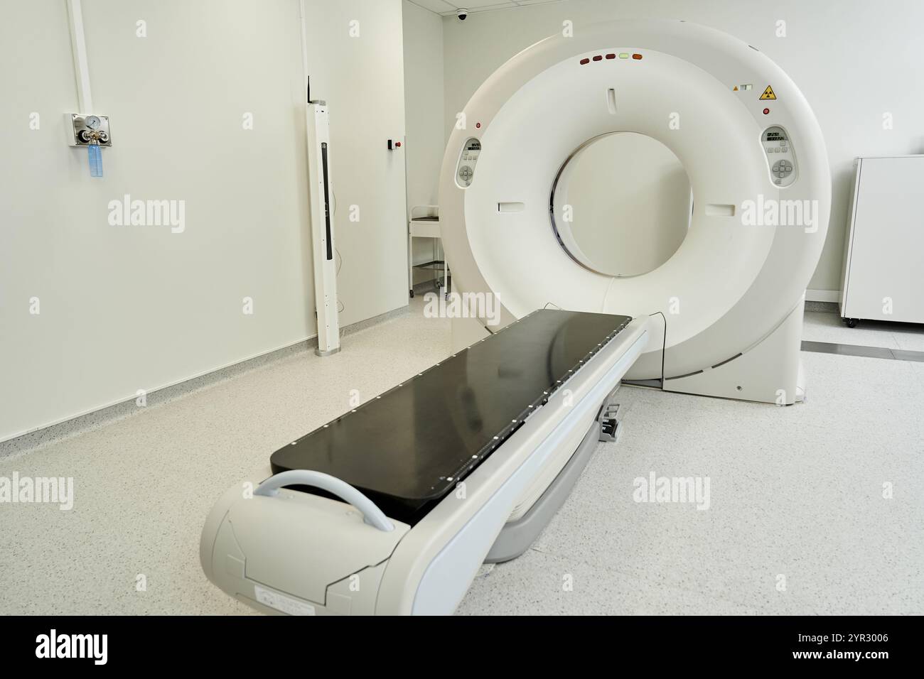 Bright and spacious hospital area with an MRI machine ready for patient ...