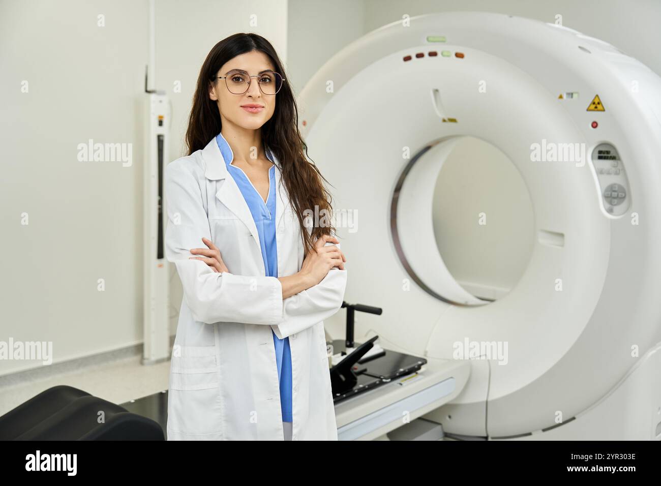 Female doctor in lab coat ensures patient care in the radiology ...