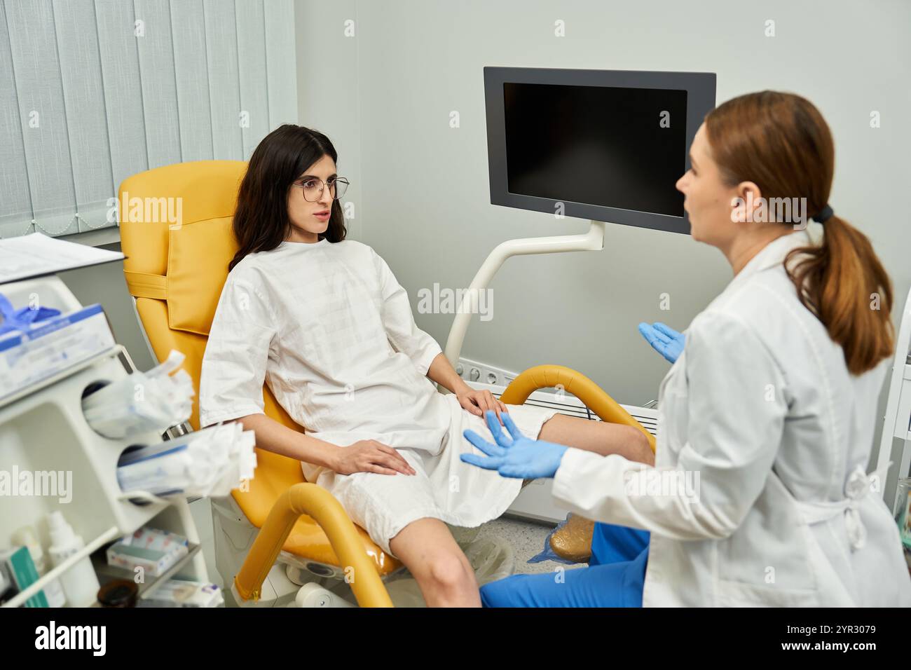 Professional gynecologist examines female patient in a welcoming ...