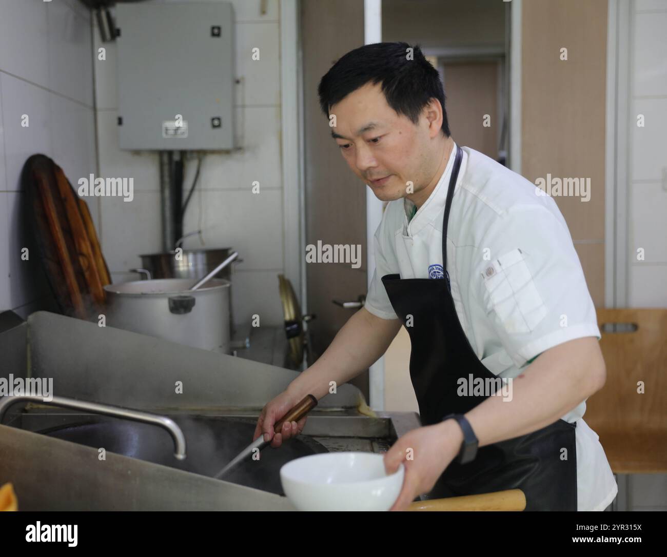 Zhongshan Station. 2nd Dec, 2024. Chef Zhang Jiangjie prepares meal at ...