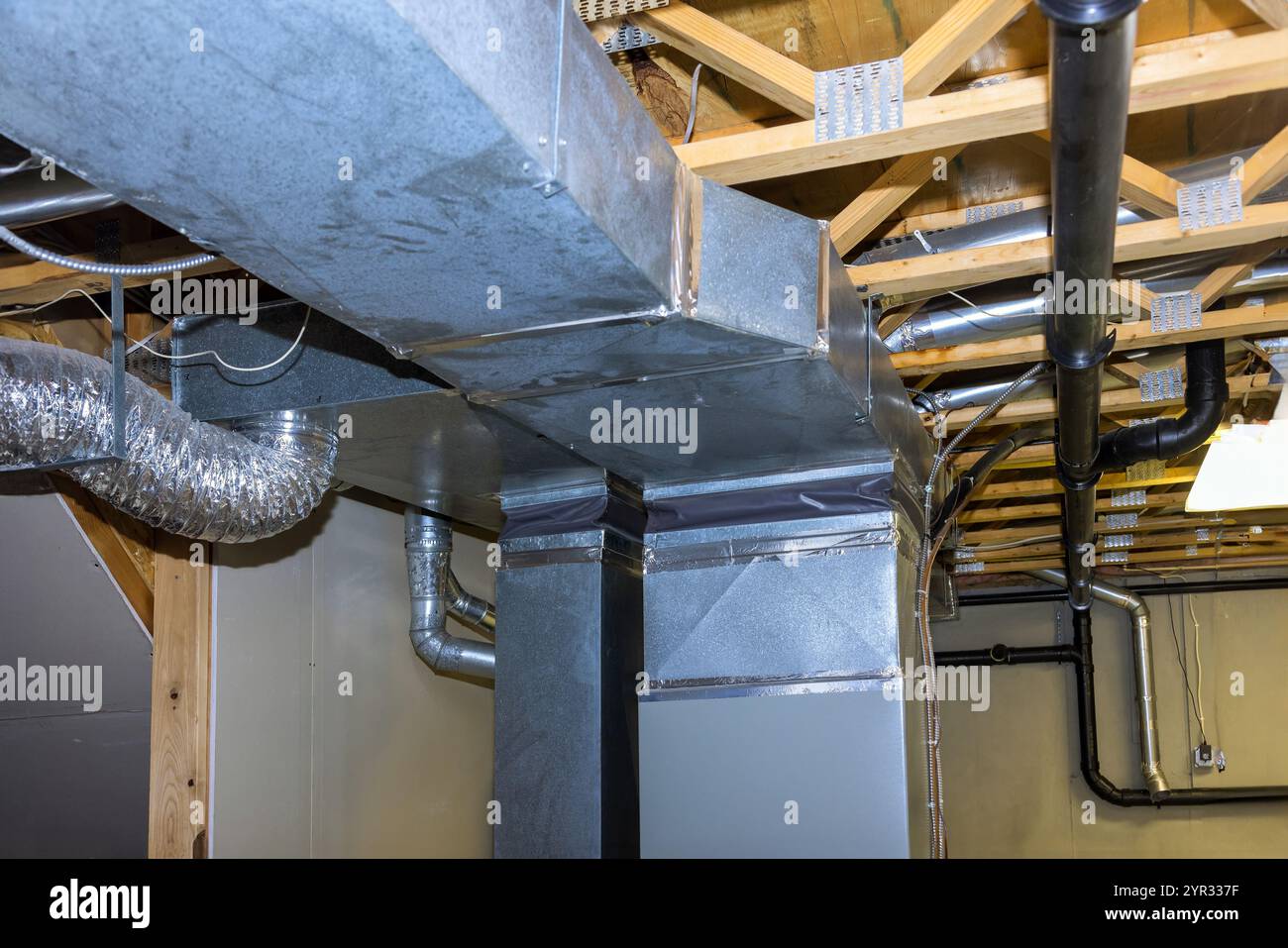 Interior space features extensive metal ductwork, piping installed in ...