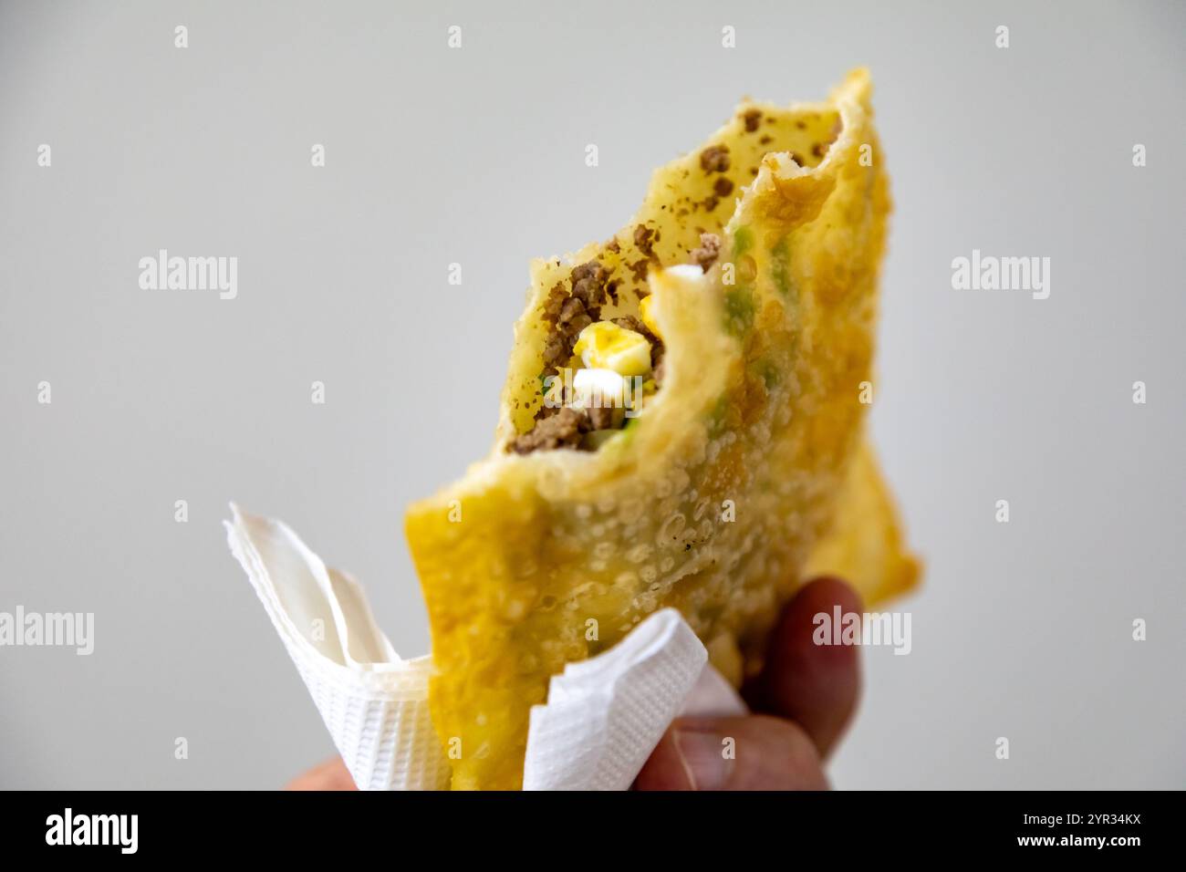 Traditional Brazilian fried pastry stuffed with ground beef. "Pastel de ...