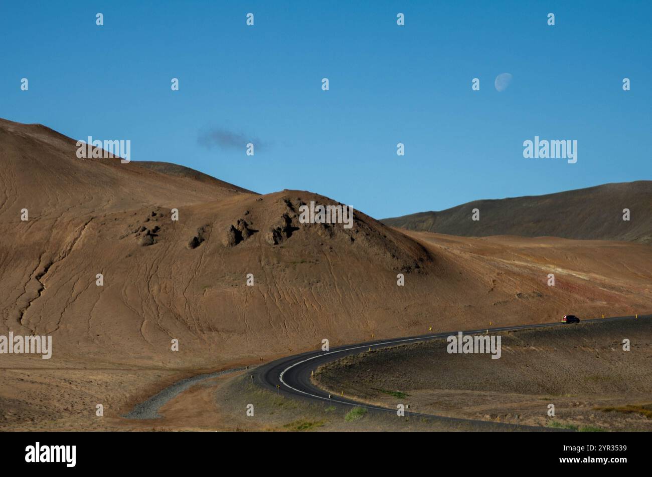 A breathtaking Icelandic landscape with towering mountains, fields, and ...