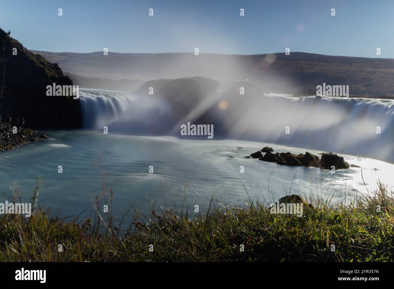 A stunning Icelandic waterfall cascading down rugged cliffs into a ...