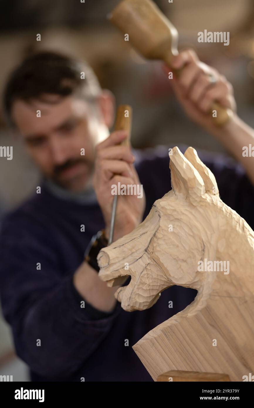 29/11/24 Pete Rix carves a horse’s head from Tulip wood. The wood block ...