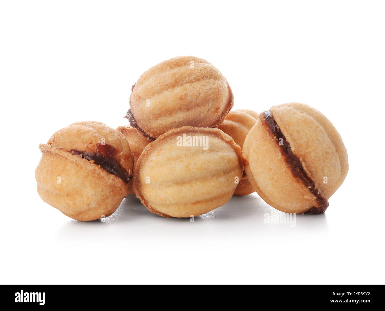 Many sweet walnut shaped cookies with boiled condensed milk on white ...