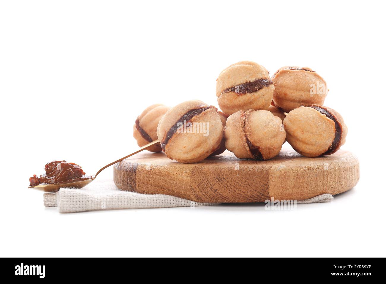 Wooden board of sweet walnut shaped cookies with boiled condensed milk ...